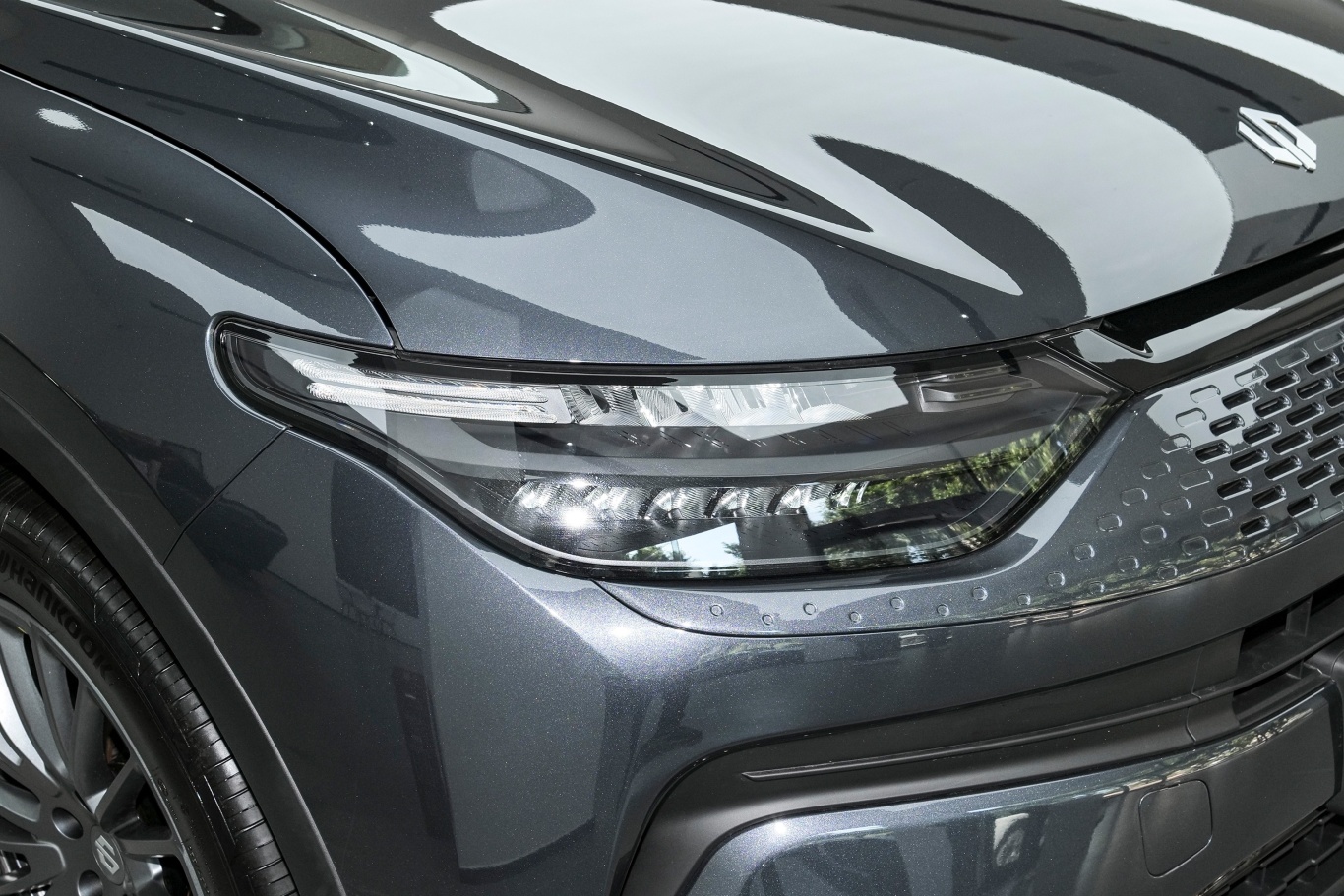 【零跑C11 增程版200km 200舒享版大灯侧45度俯拍图片-汽车图片大全】-易车